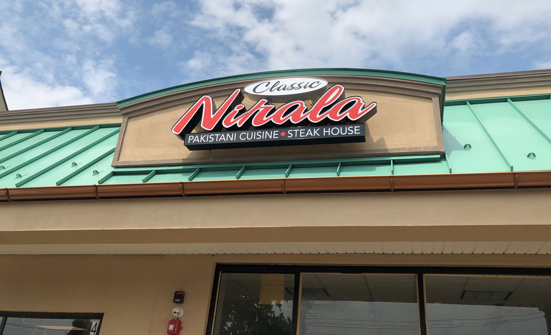 Classic Nirala Wall Sign - Ace Sign Inc.